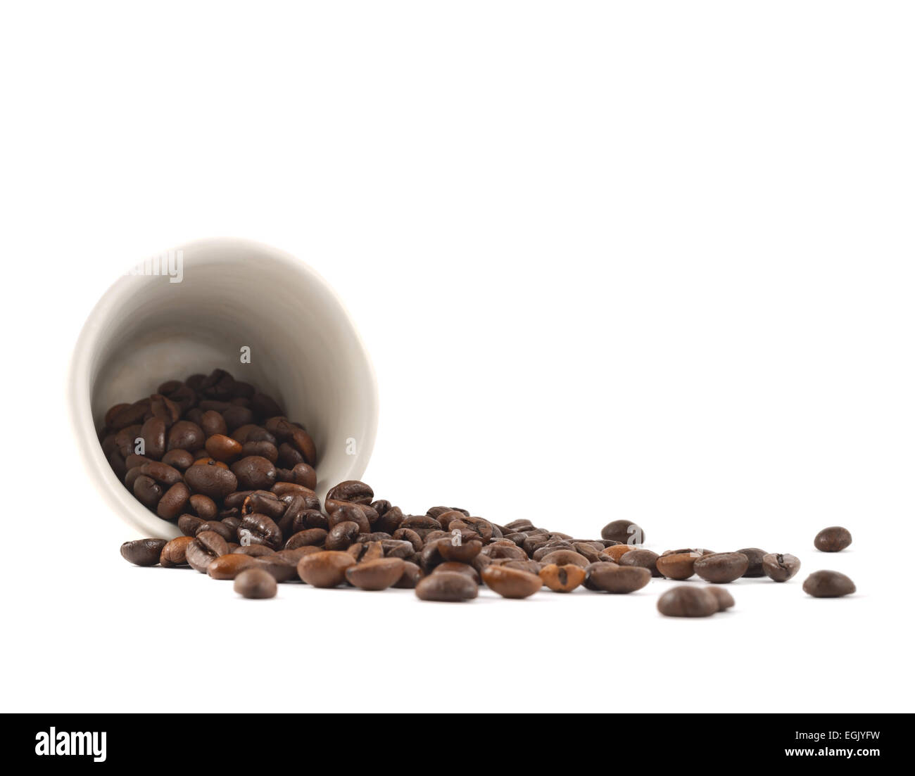 Spilled coffee beans from the cup isolated Stock Photo - Alamy