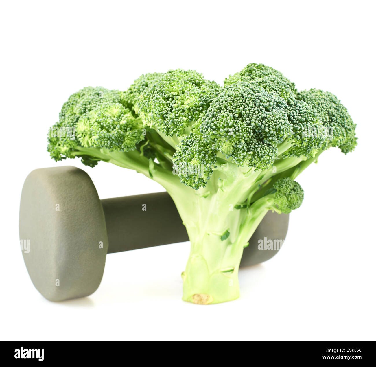 Green broccoli next to a dumbbell Stock Photo - Alamy