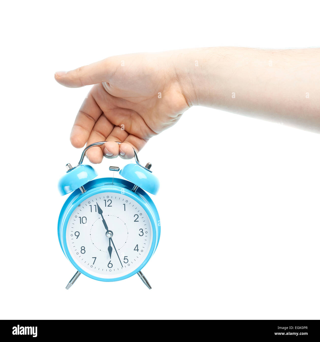 Caucasian male hand holding alarm clock Stock Photo - Alamy