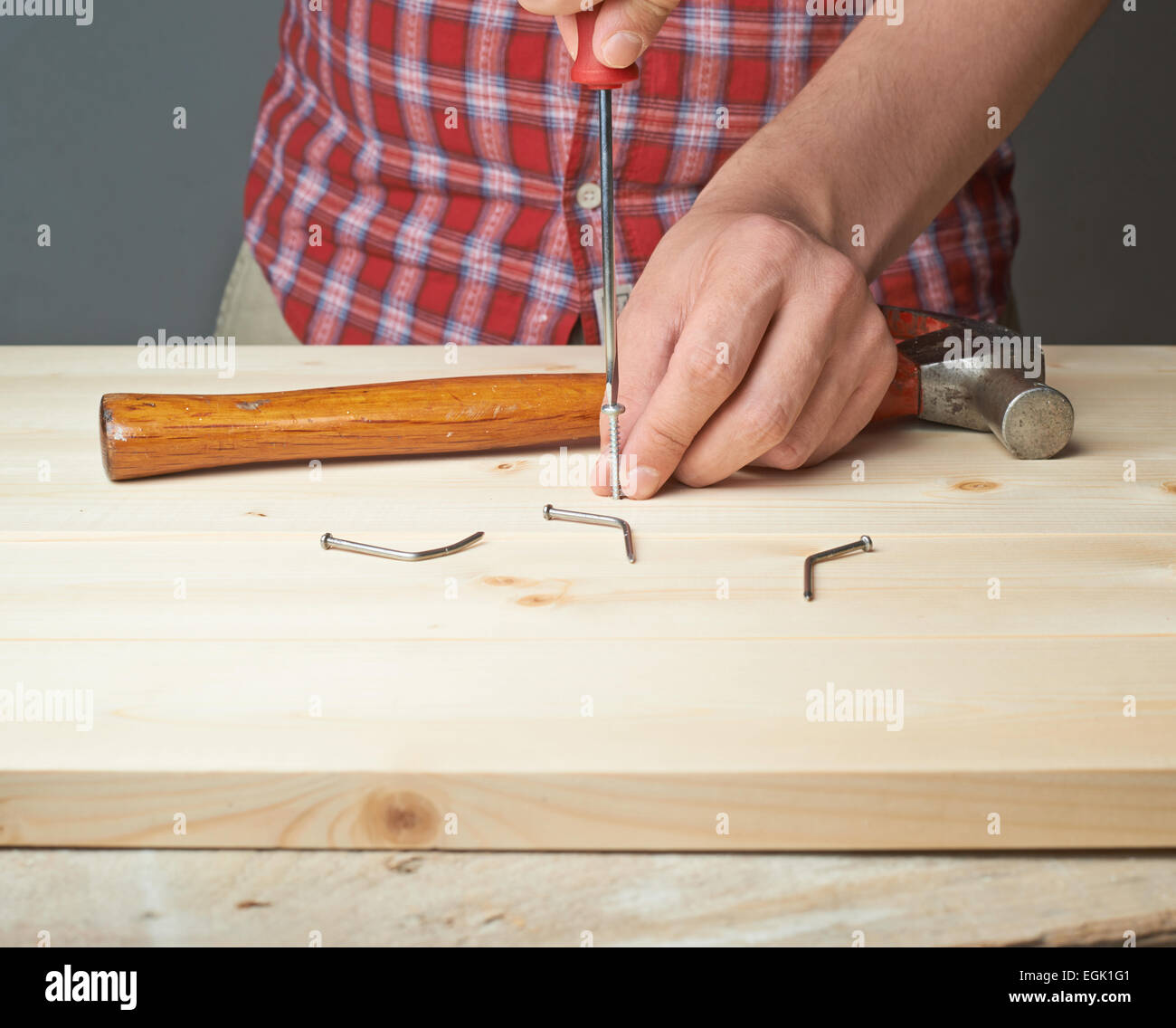 Screwing the screw composition Stock Photo - Alamy