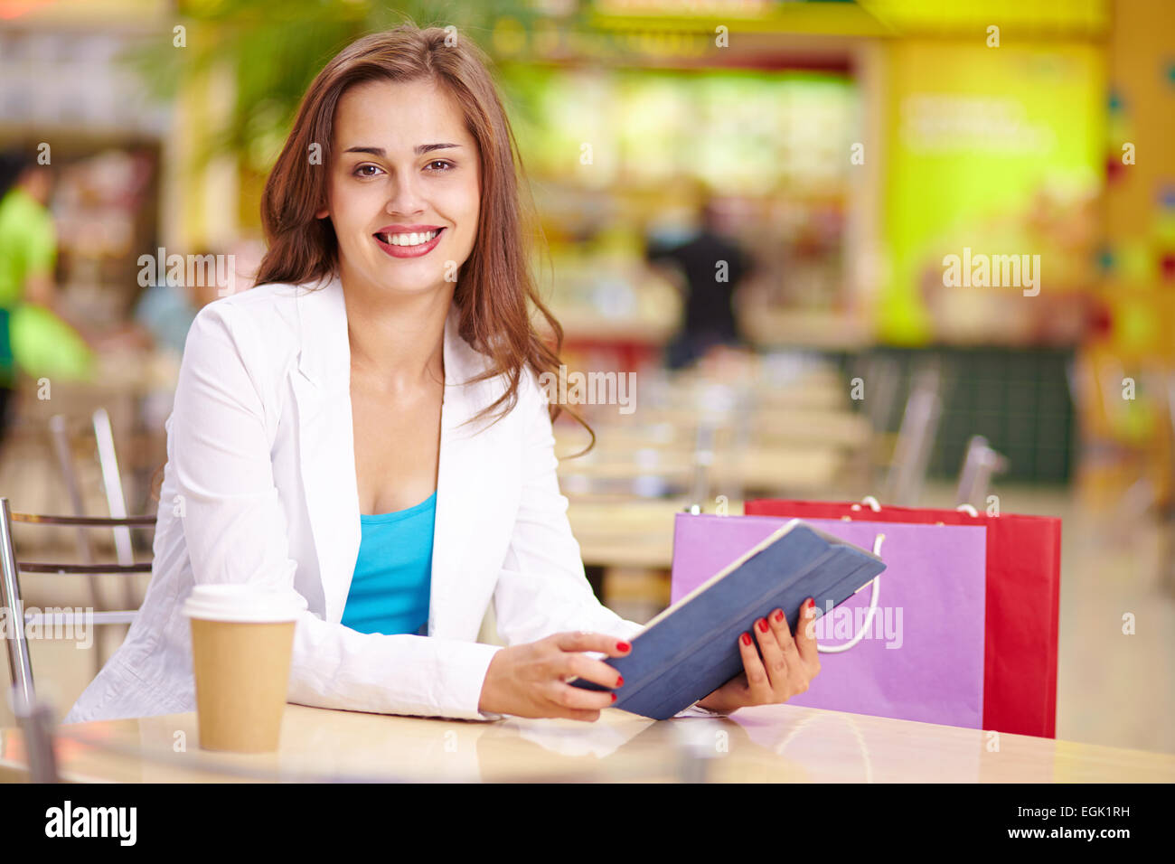 Attractive shopper looking at camera during rest after shopping Stock ...
