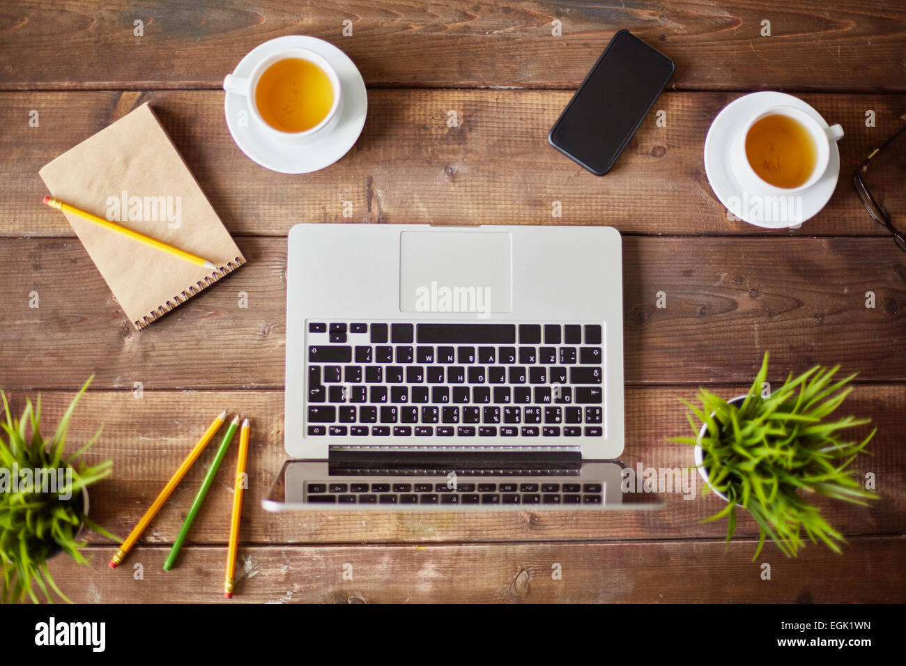 Laptop, cellphone and other business objects on workplace Stock Photo ...