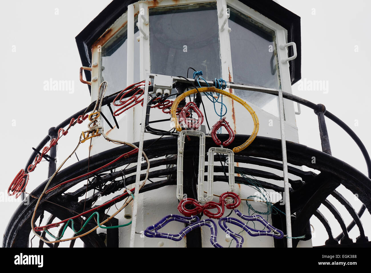 Old Christmas illuminated decorations hanging from lighthouse on ...