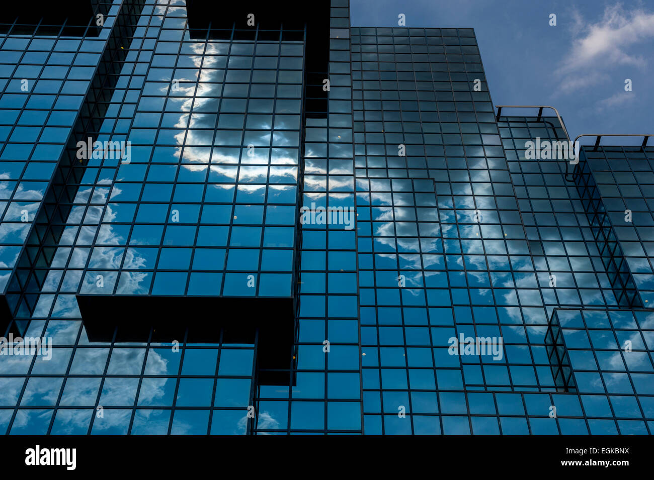 Glass walled office building reflecting stormy clouds. London Stock ...
