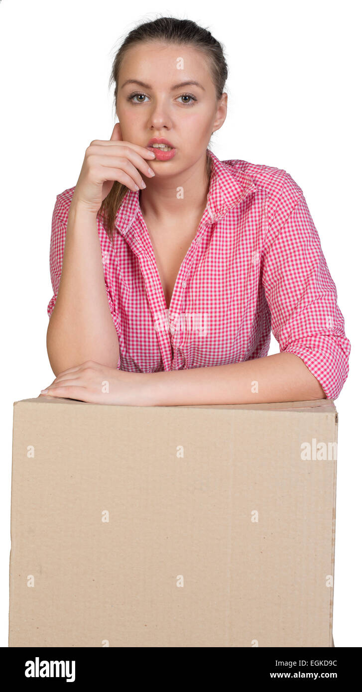 Woman leaning on cardboard box Stock Photo - Alamy