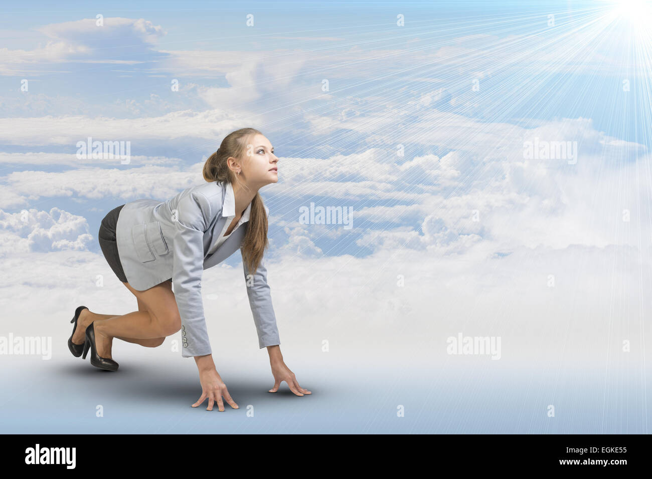 Businesswoman standing in running start pose Stock Photo - Alamy