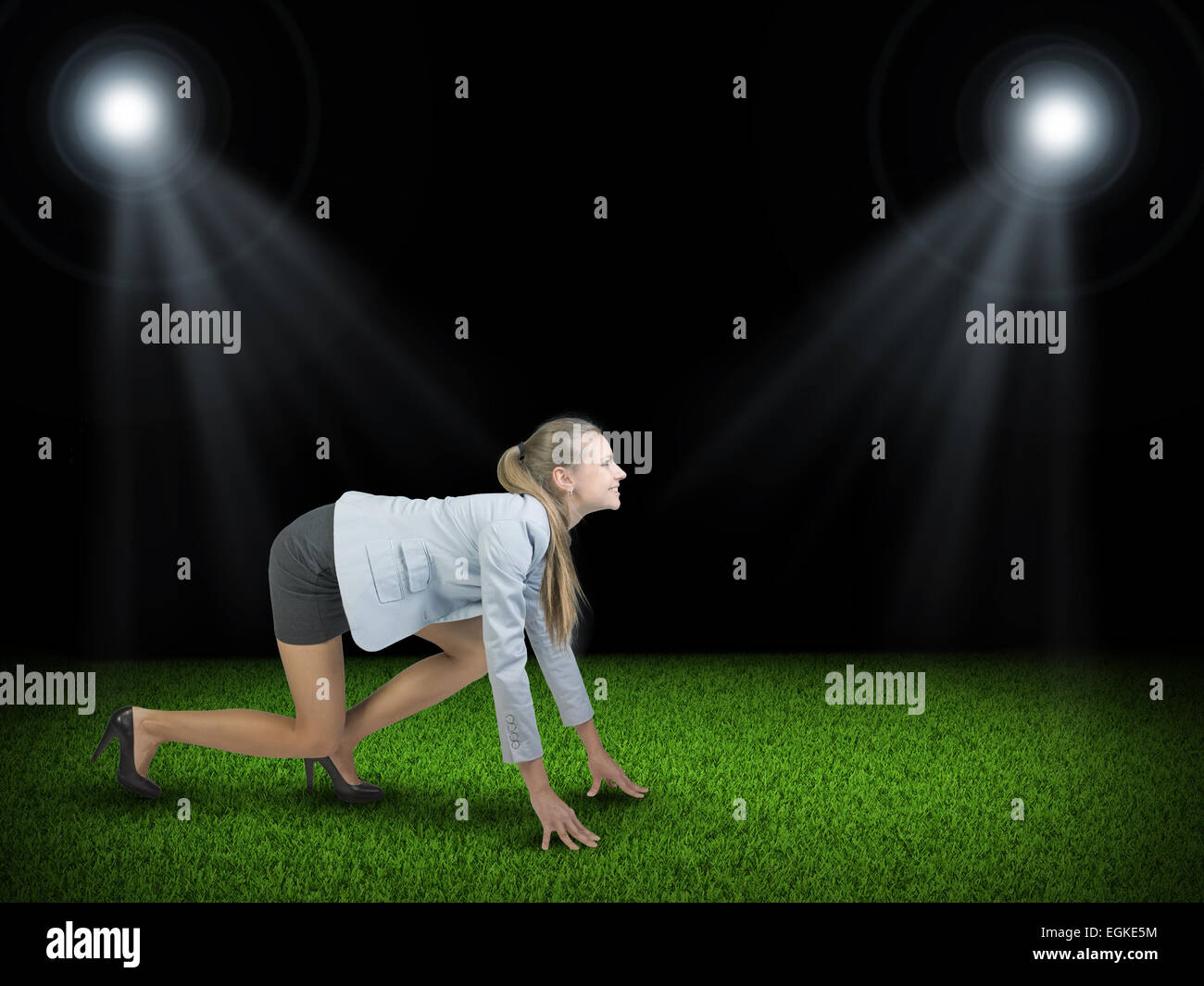 Businesswoman standing in running start pose Stock Photo - Alamy