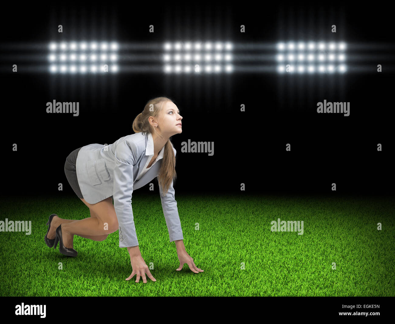 Businesswoman standing in running start pose Stock Photo - Alamy