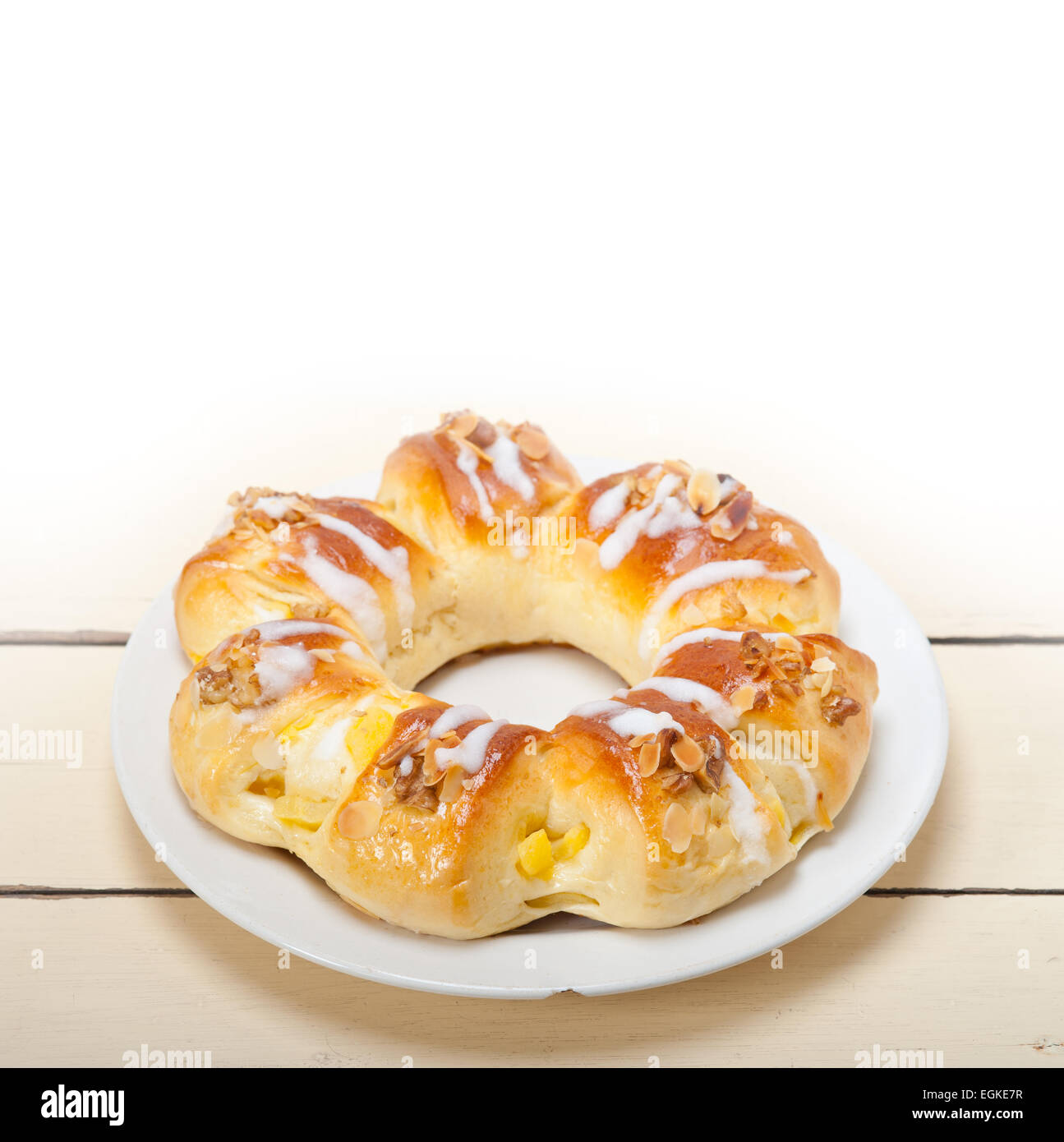 fresh home baked sweet bread donut cake with almonds and icing sugar on ...