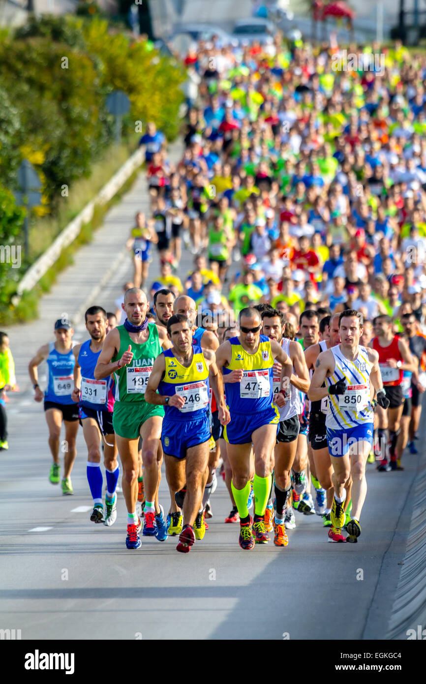 SAN FERNANDO, SPAIN - MAR 23: Unidentified runners on the street during ...