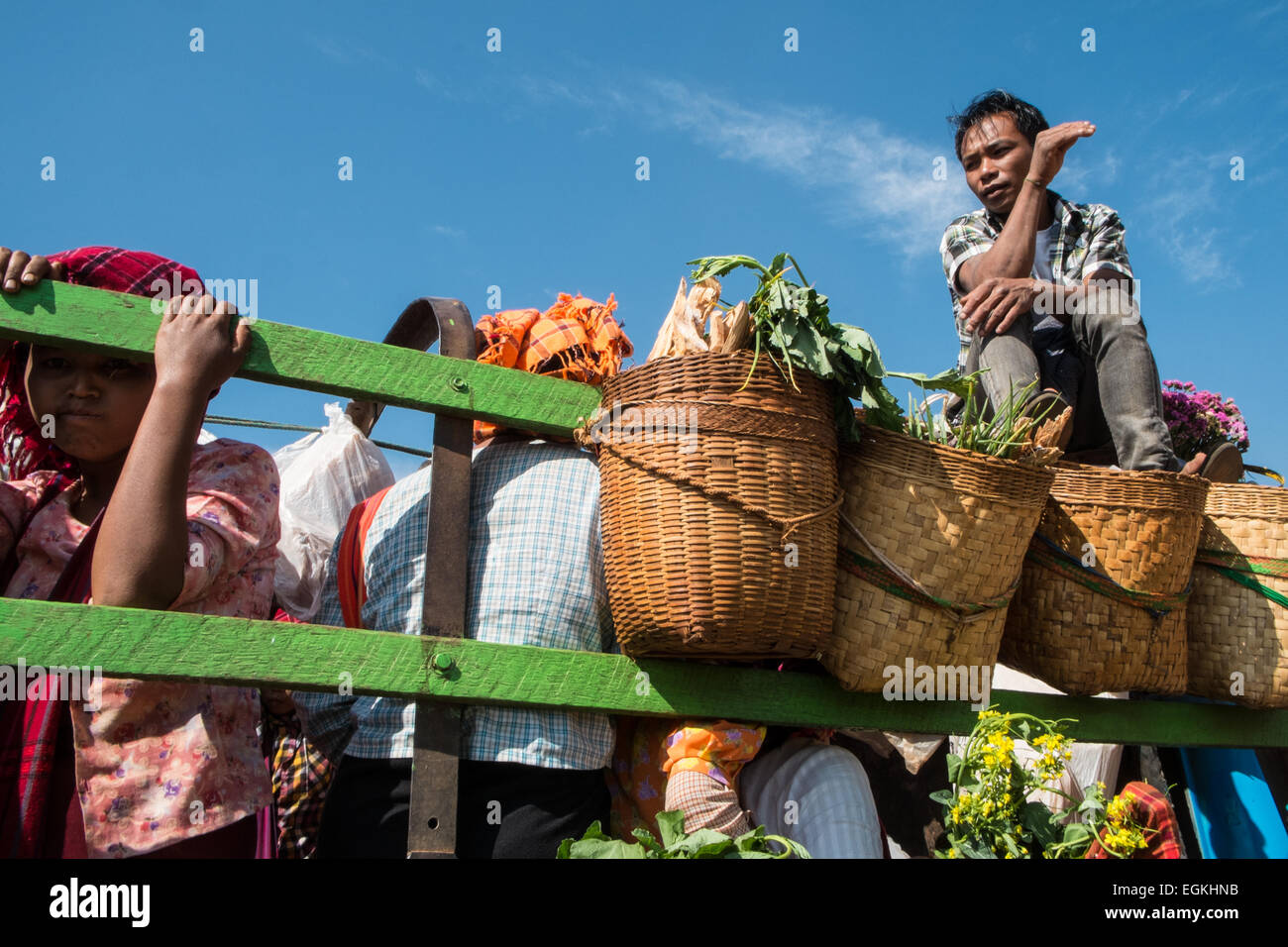 Women on full open truck returning home after shopping at local market ...