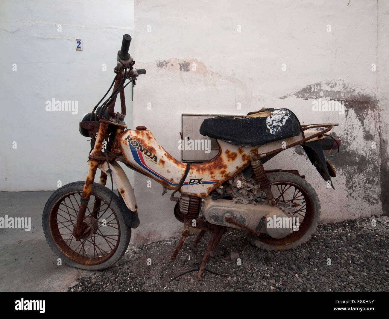 A rusting moped in a backstreet in Spain Stock Photo - Alamy
