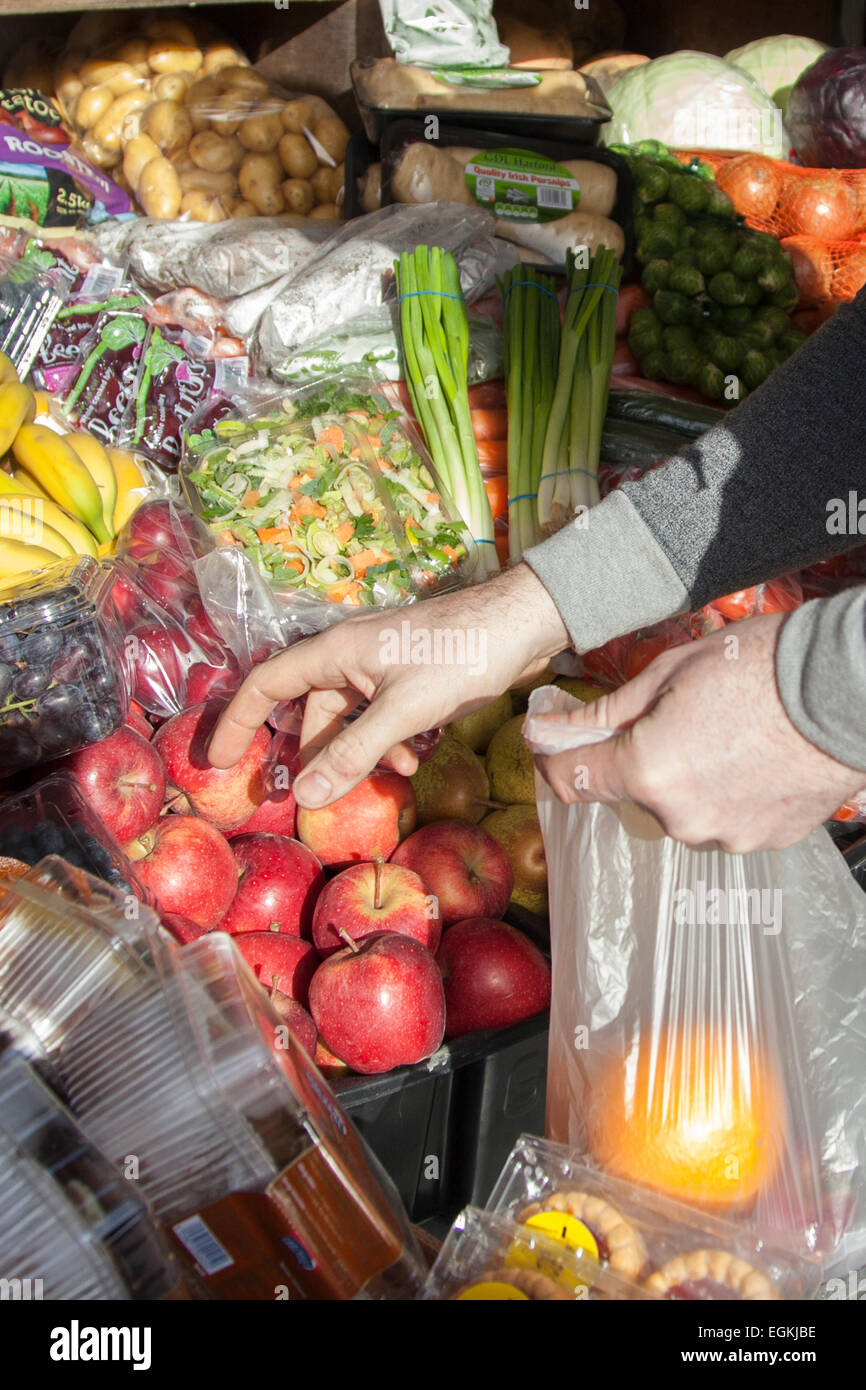 Hands selecting fruit Stock Photo - Alamy