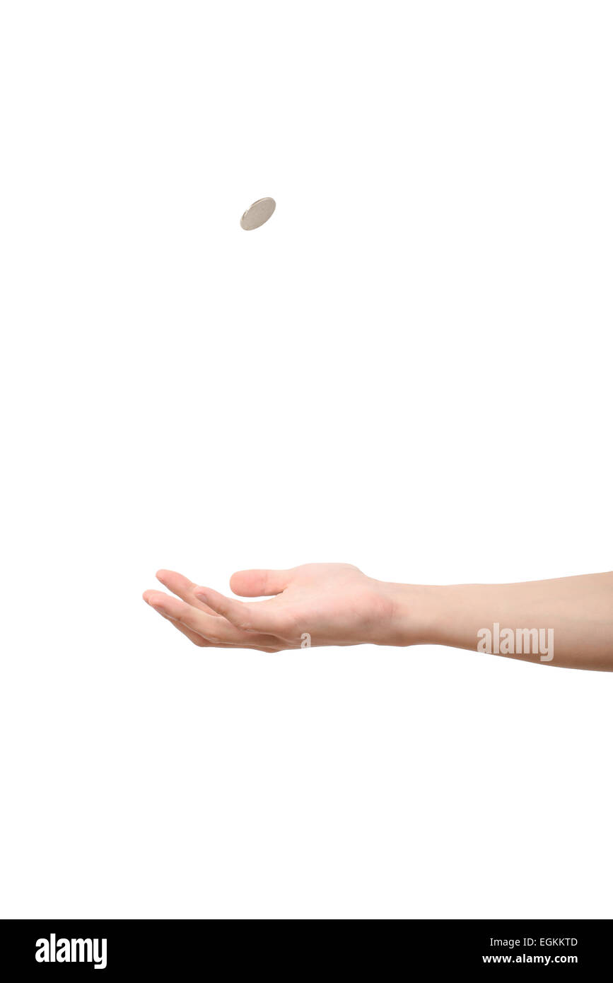 hand catching tossed coin, isolated on white Stock Photo - Alamy