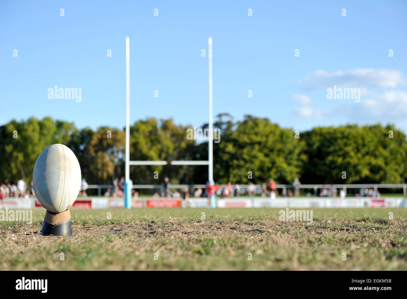 Rugby football placed in the middle of a playing field, waiting to be ...