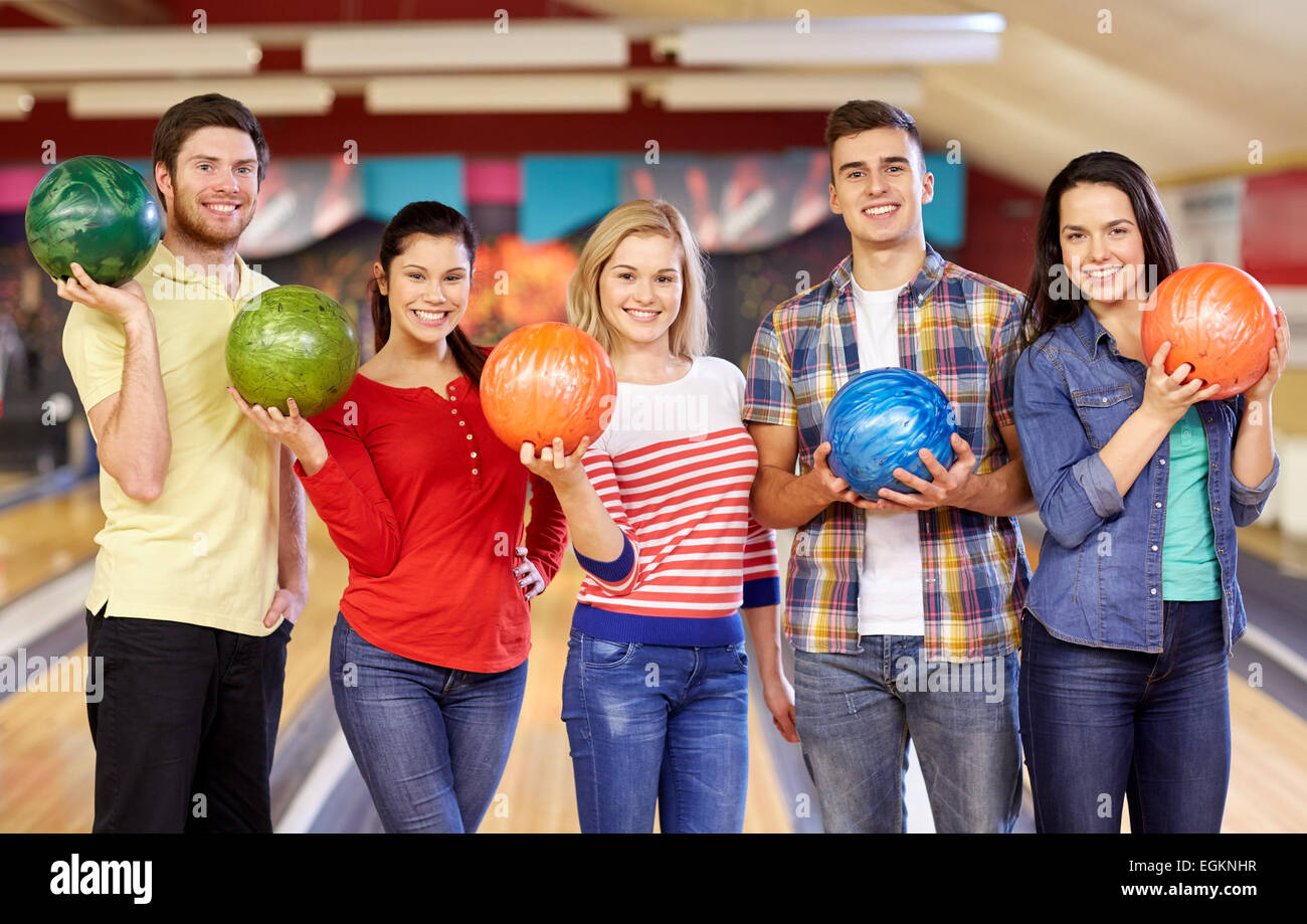 happy friends in bowling club Stock Photo - Alamy