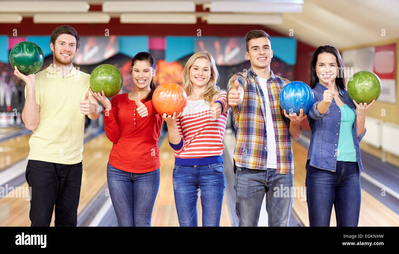 happy friends in bowling club Stock Photo - Alamy
