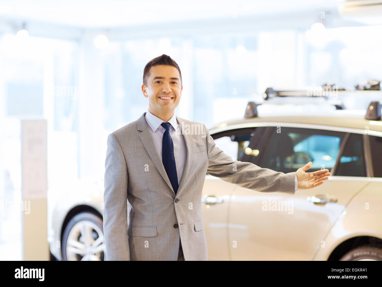 happy man at auto show or car salon Stock Photo - Alamy