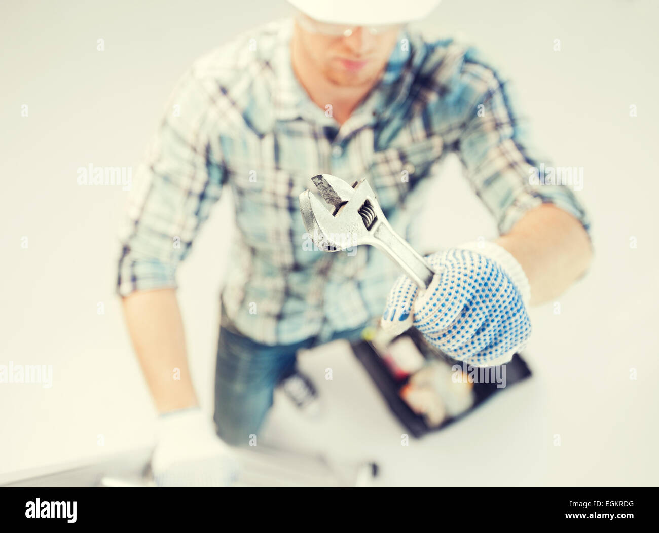 man with ladder, toolkit and spanner Stock Photo - Alamy