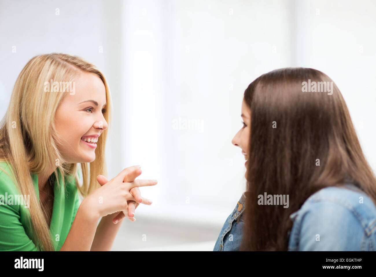 student girls gossiping at school Stock Photo - Alamy