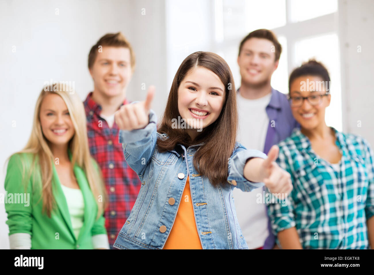students showing thumbs up at school Stock Photo - Alamy