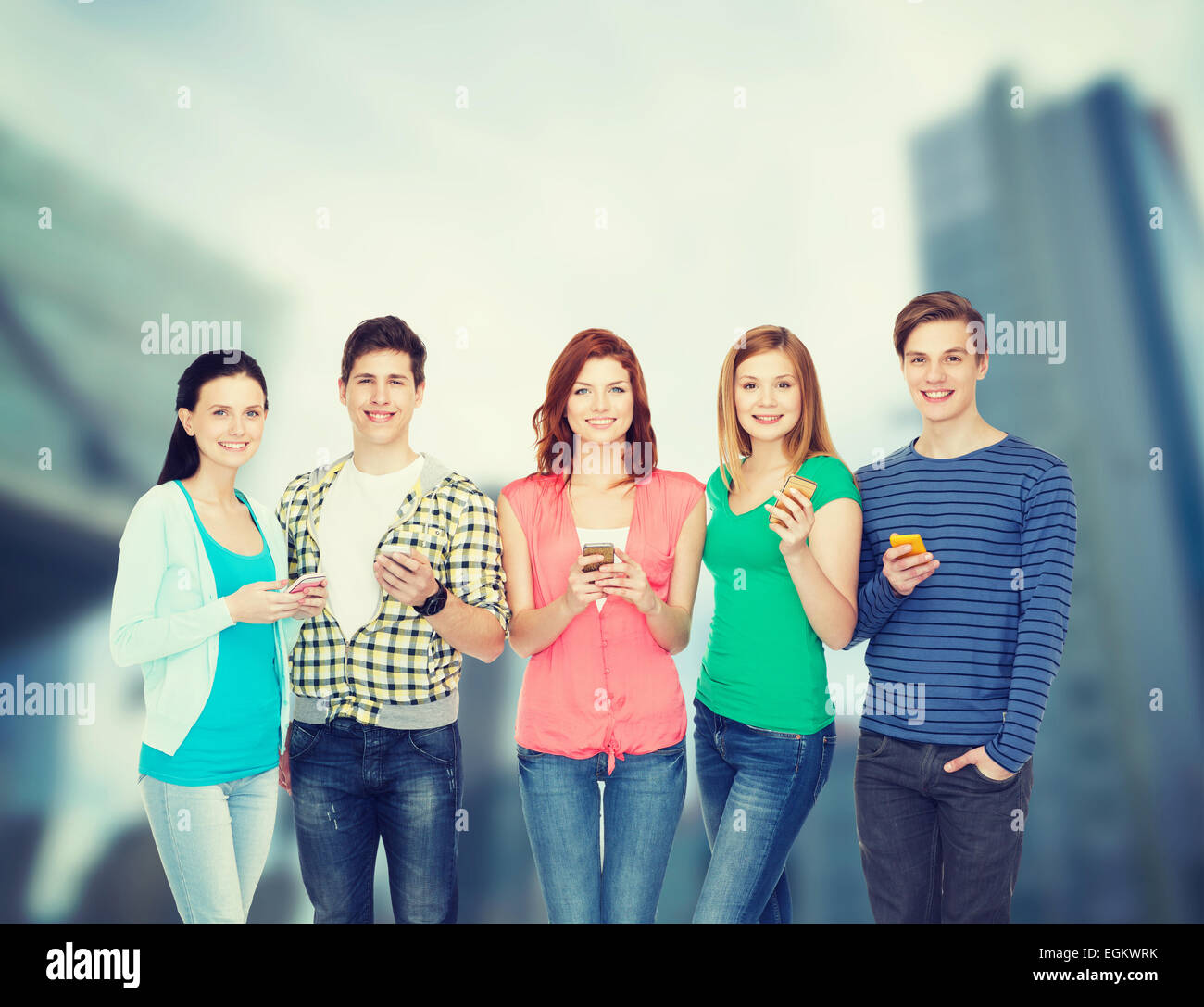 smiling students with smartphones Stock Photo - Alamy