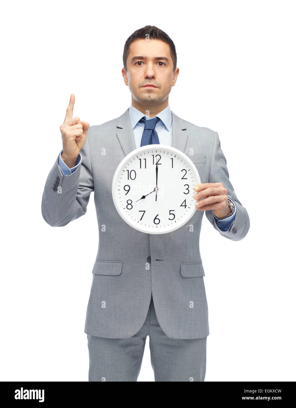 businessman in suit holding clock with 8 o'clock Stock Photo - Alamy