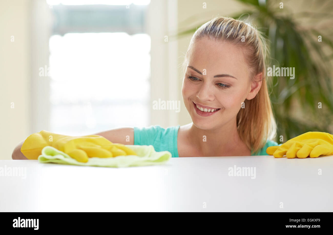 happy woman cleaning table at home kitchen Stock Photo - Alamy