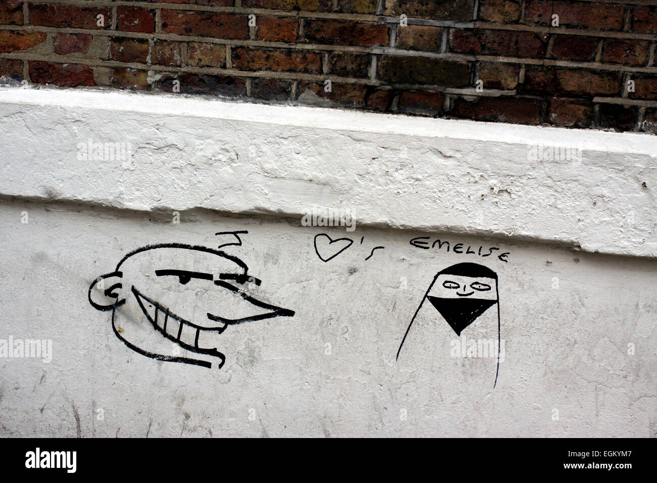 Crude graffiti on a wall near Brick Lane, East London Stock Photo - Alamy