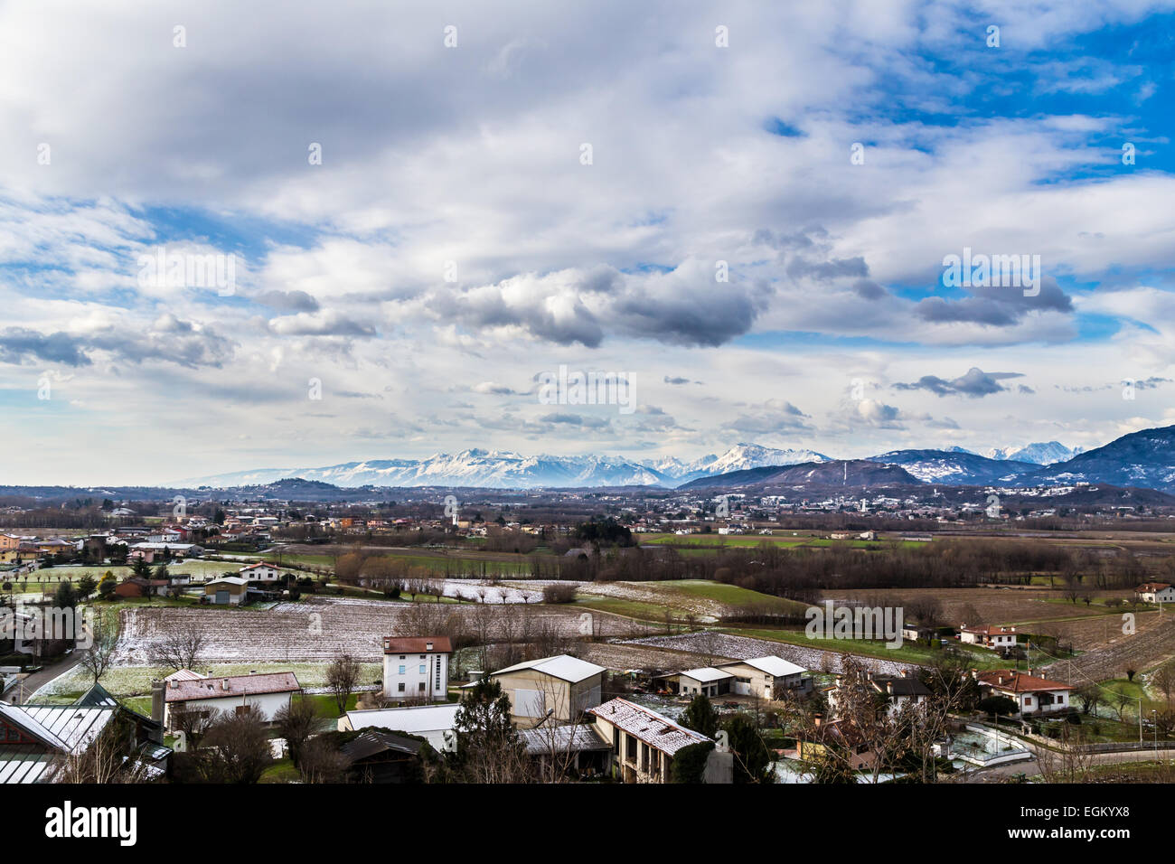 a light snowfall on the italian countryside, with white fields and ...
