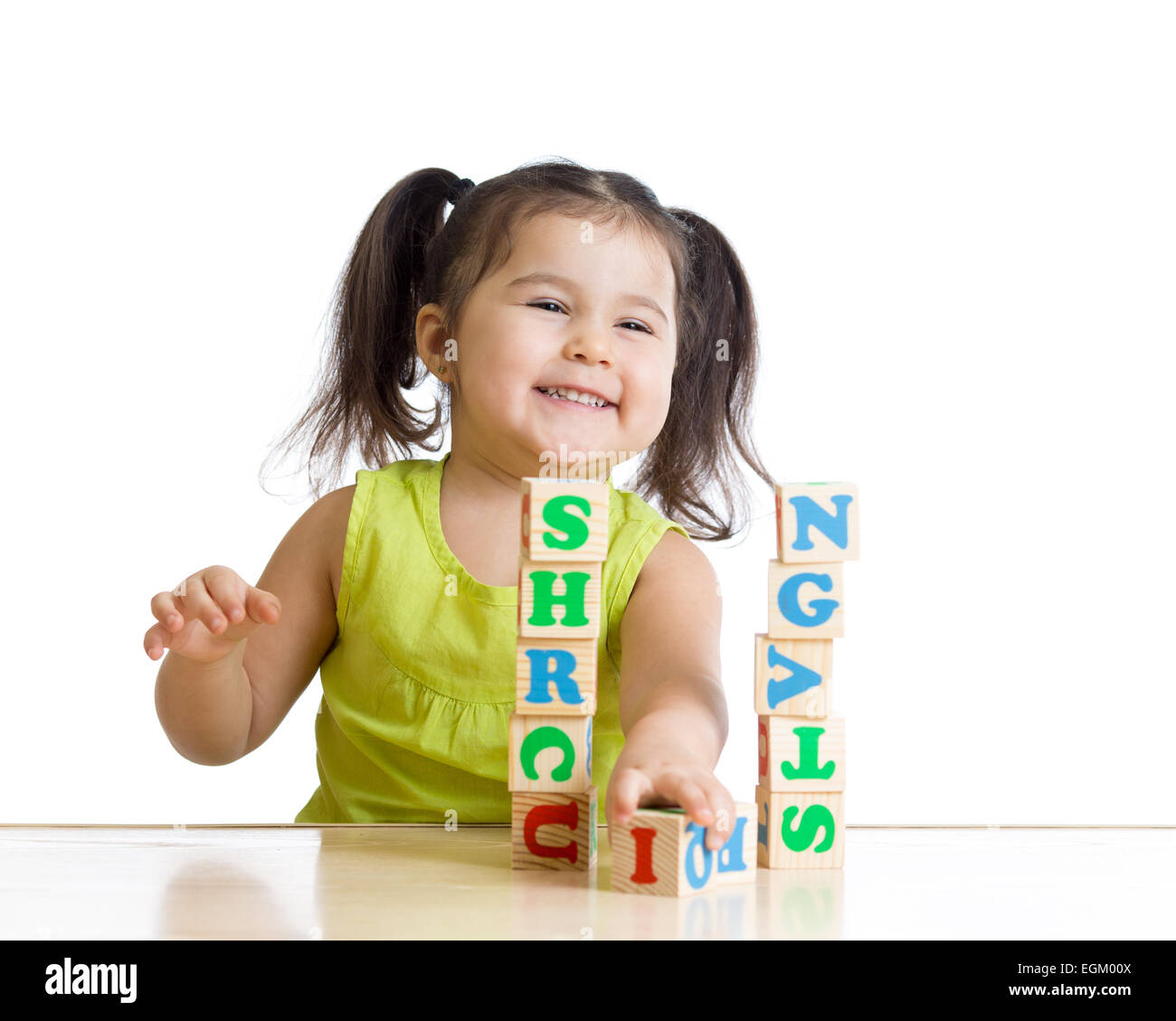Child playing with letter blocks hi-res stock photography and images ...