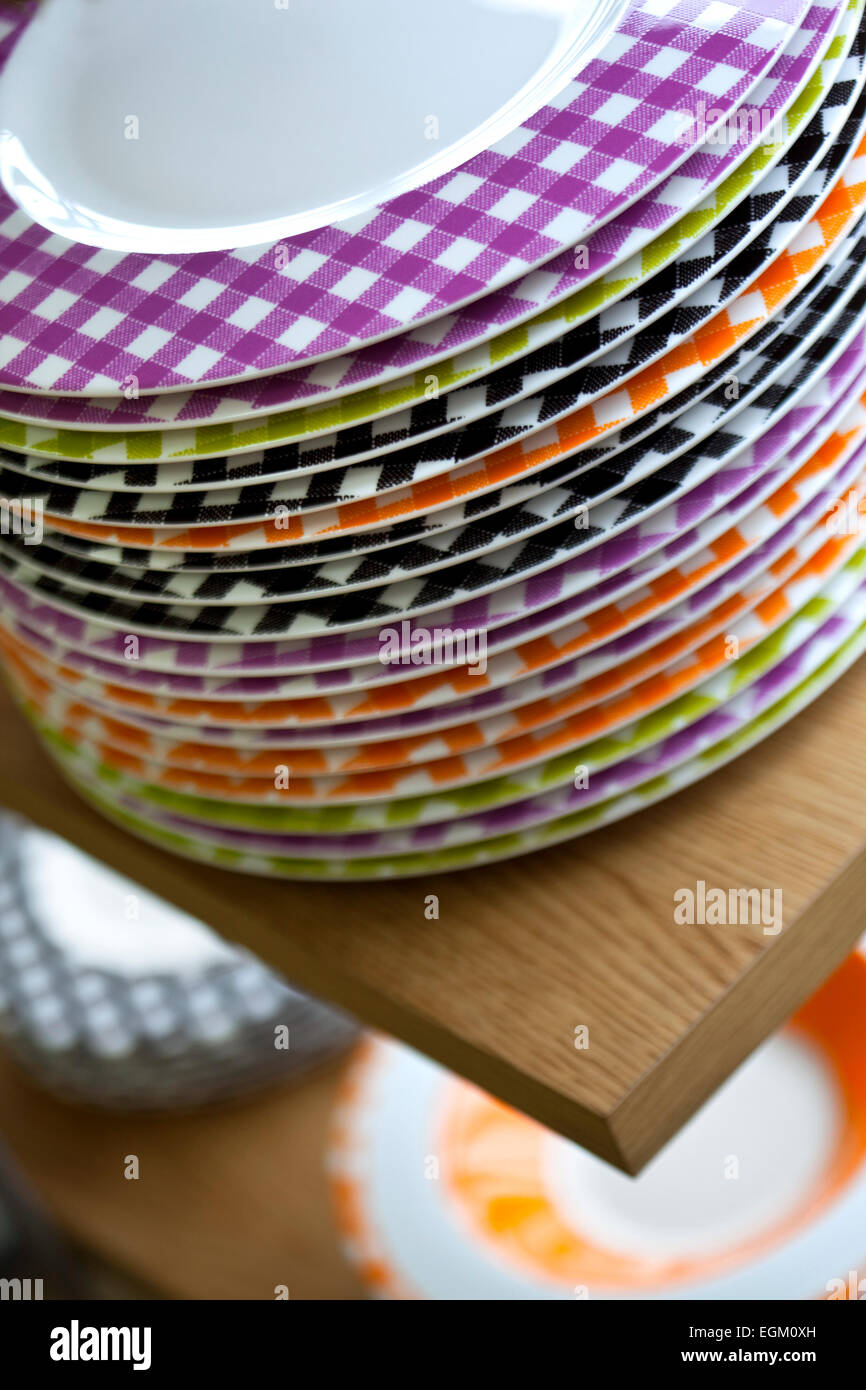 Pile of plates on table hi-res stock photography and images - Alamy