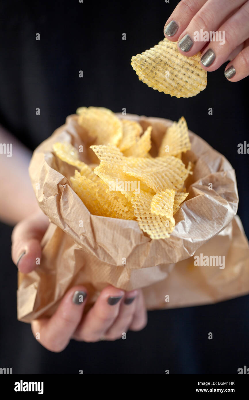 Womans Hands Holding a Brown Bag of Handmade Gourmet Crisps Stock Photo ...