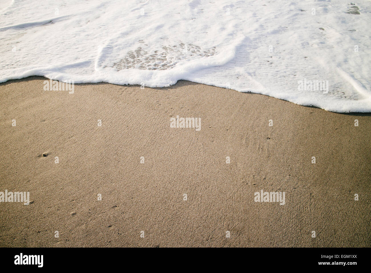 sand beach and gentle surf Stock Photo - Alamy