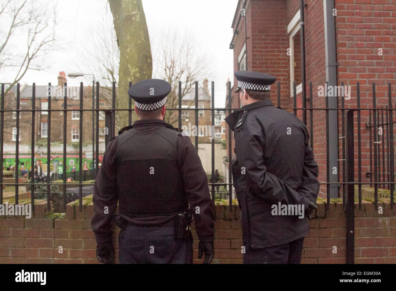 London UK.26th February 2015. Police officers stand outside the London ...