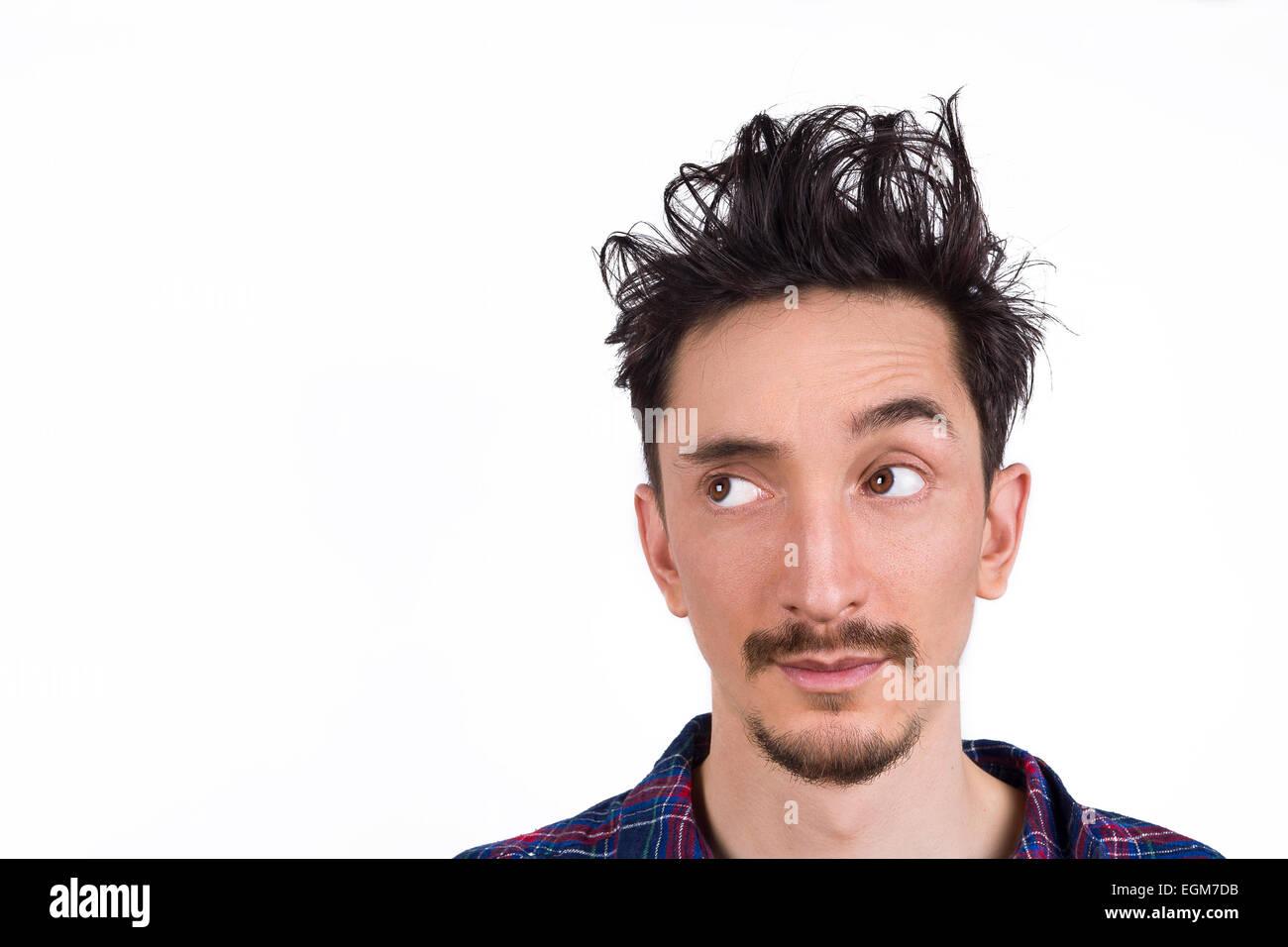 Portrait of a man in pajamas and bed hair looking to the left. isolated ...