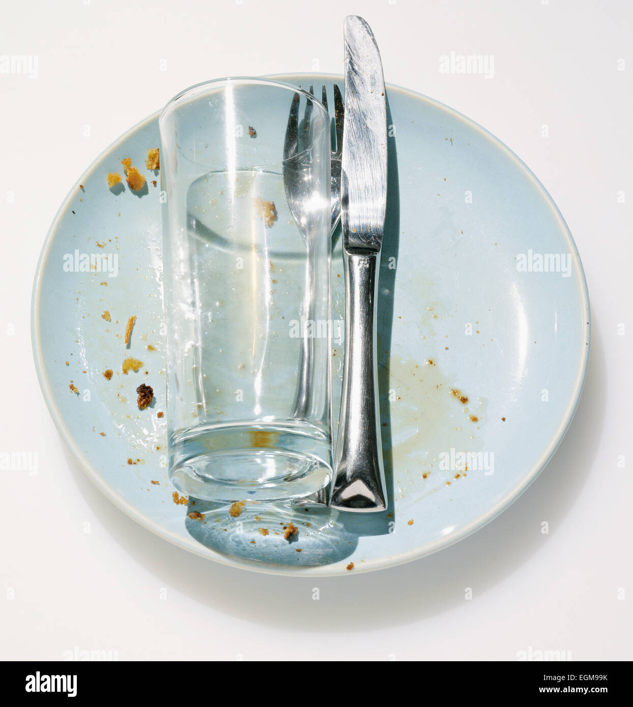 Dirty Plate with Silverware and Glass Stock Photo - Alamy