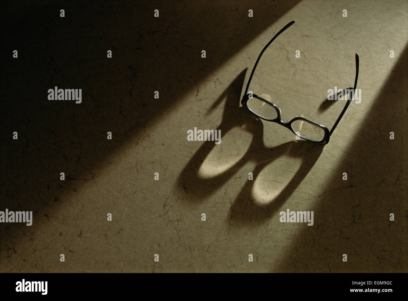 Eyeglasses and Shadow Stock Photo - Alamy