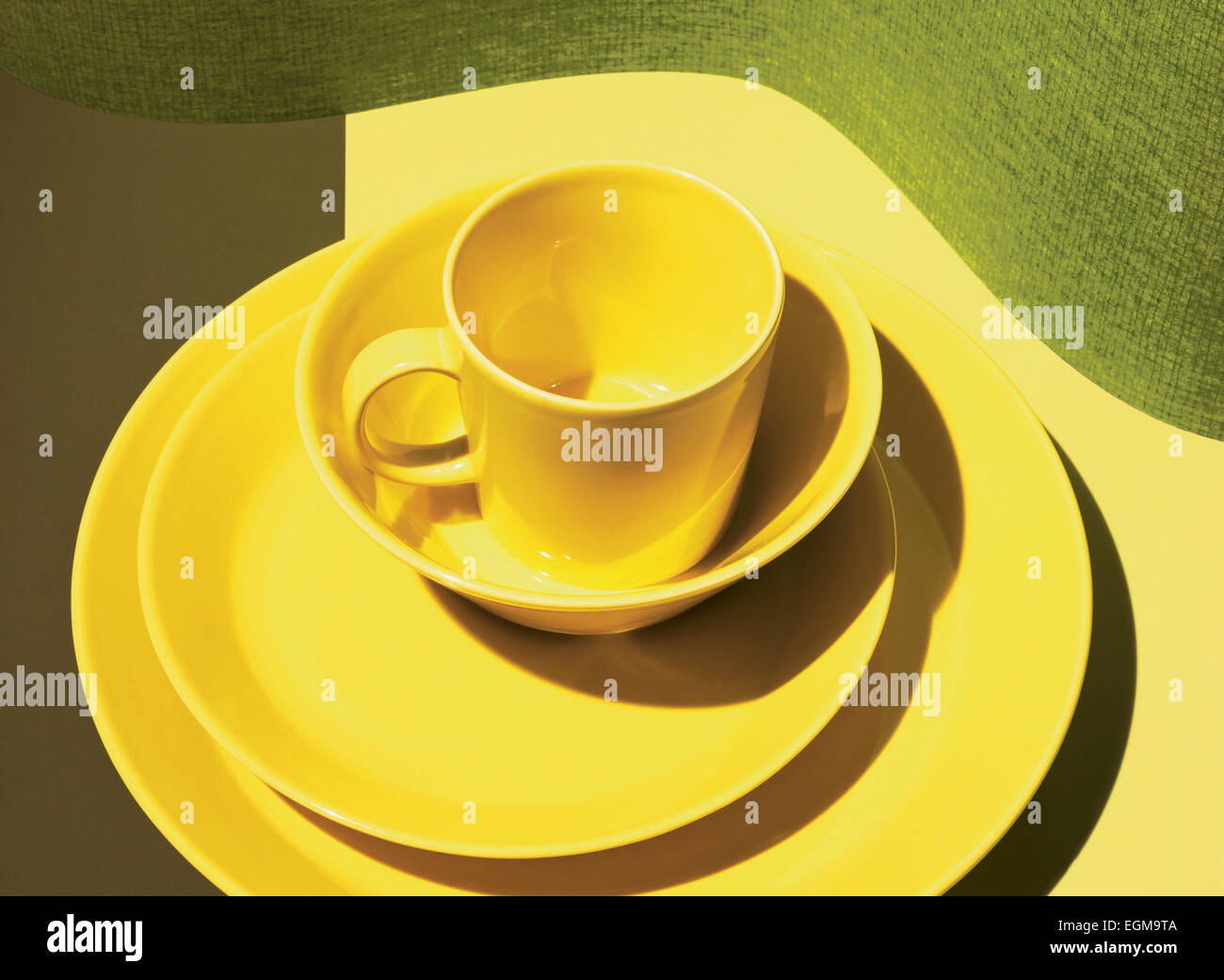 Yellow Plates with Cup Stock Photo - Alamy