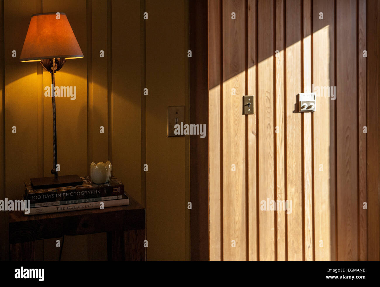 Bedroom Lamp and Wood Paneling with Sunshine in Hallway Stock Photo - Alamy