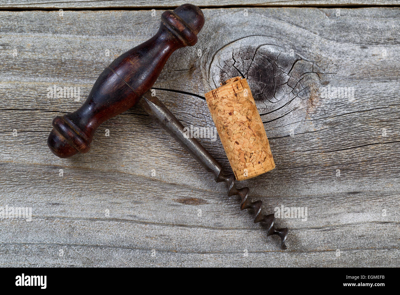 Top view angled shot of vintage corkscrew with single used cork on ...