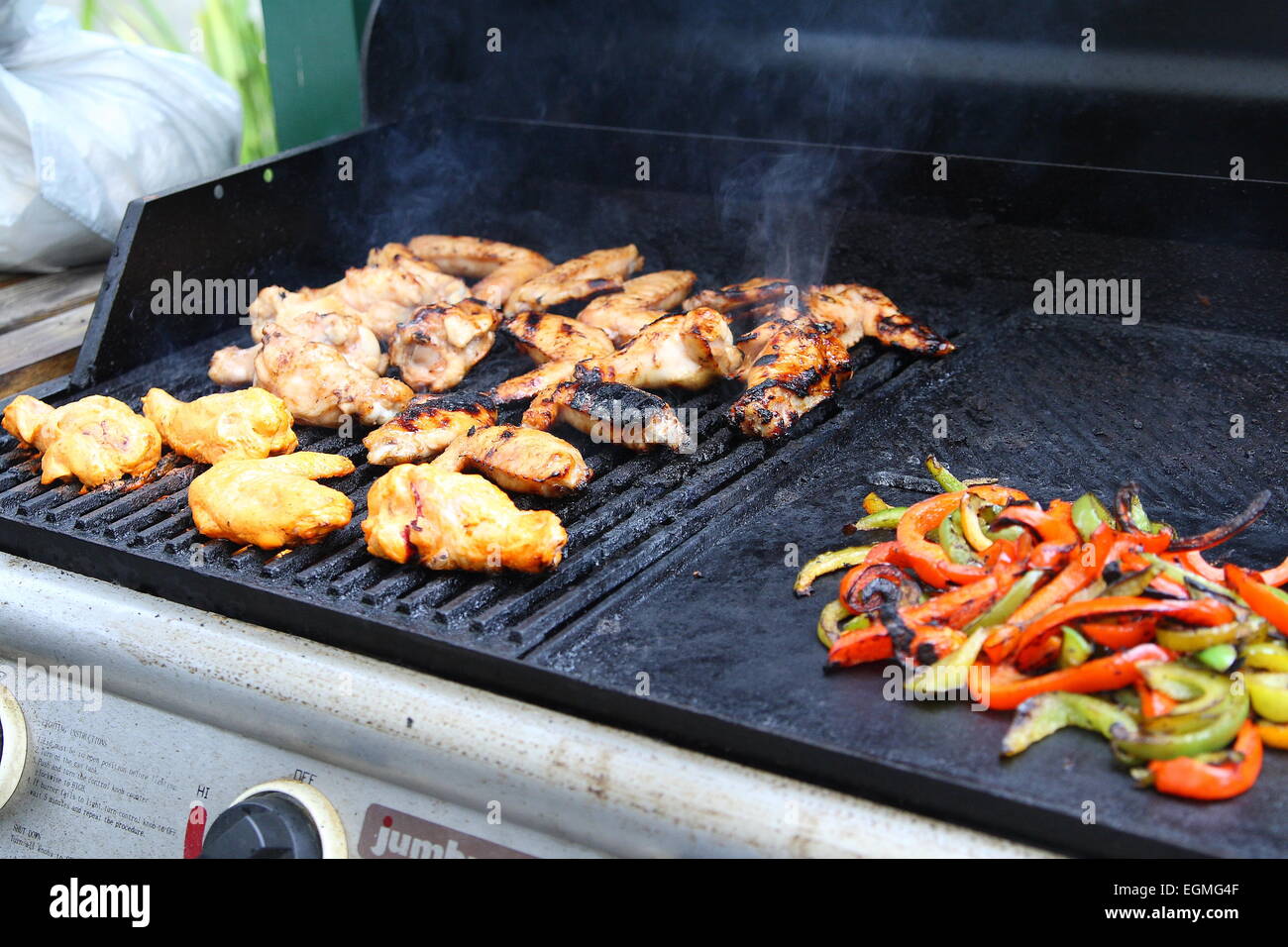 Cooking food on barbecue grill Stock Photo - Alamy