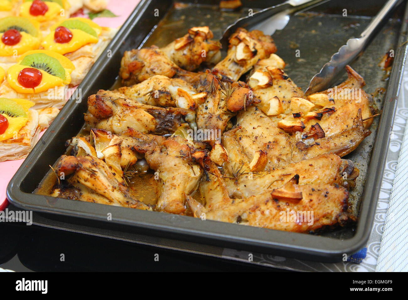 Roasted Chicken pieces in a tray Stock Photo - Alamy