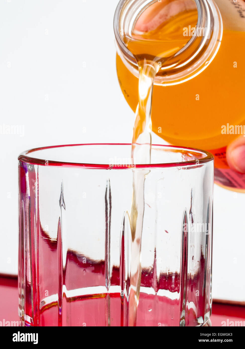 Pouring Colorful Energy or Fruit Drink Stock Photo - Alamy