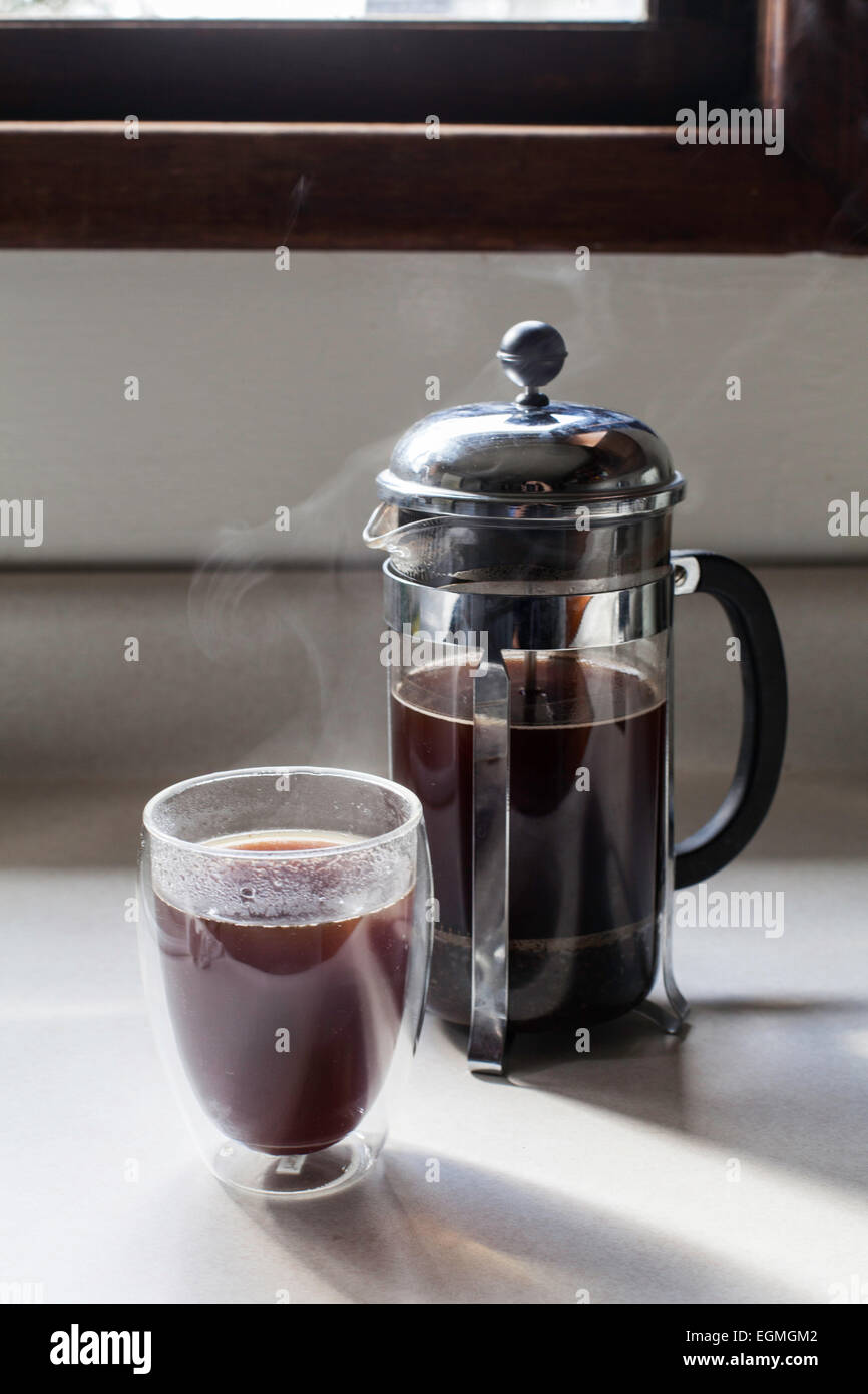Photograph of a French press and coffee cup Stock Photo - Alamy