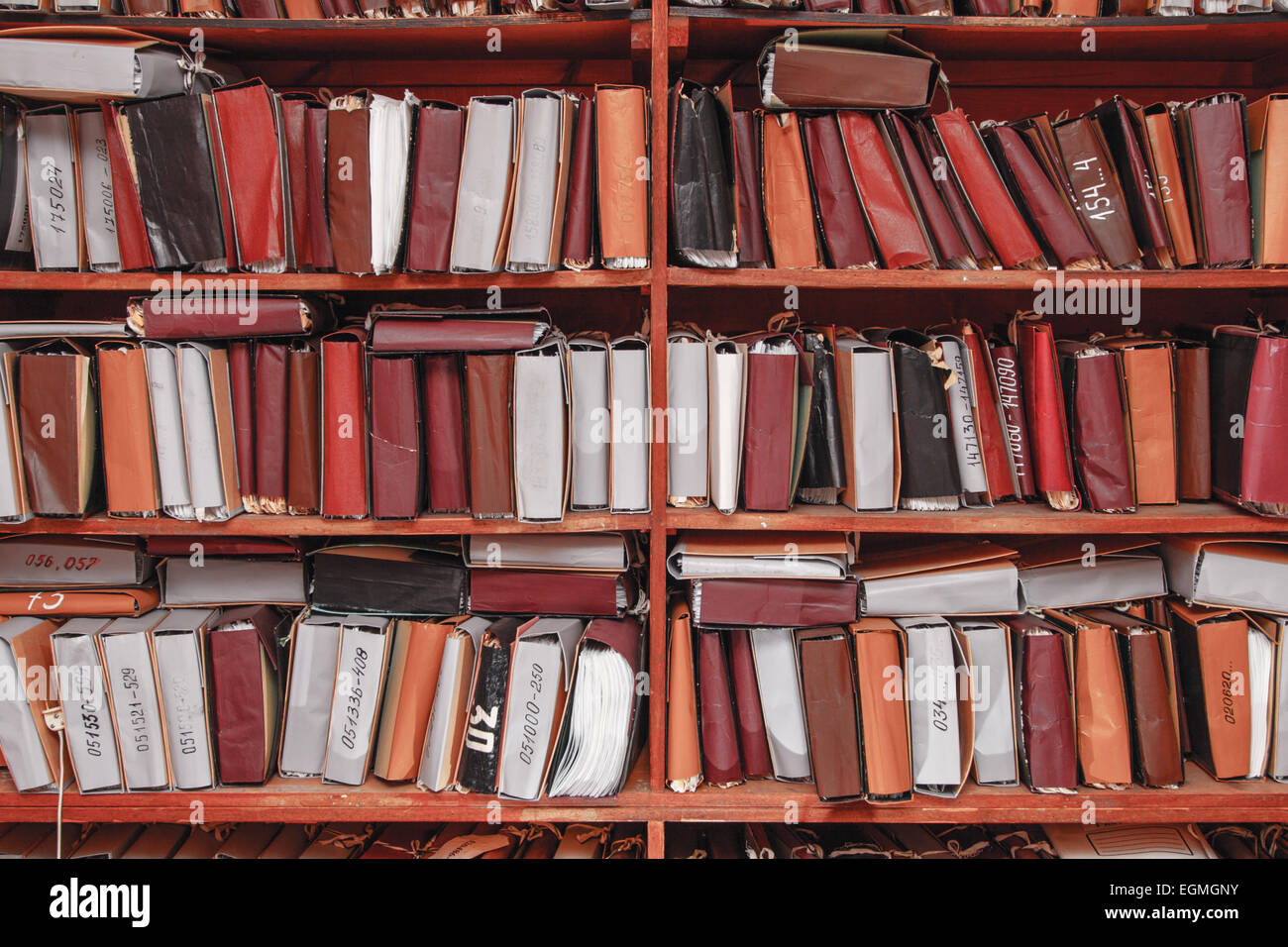 Paper documents stacked in archive on shelf Stock Photo - Alamy