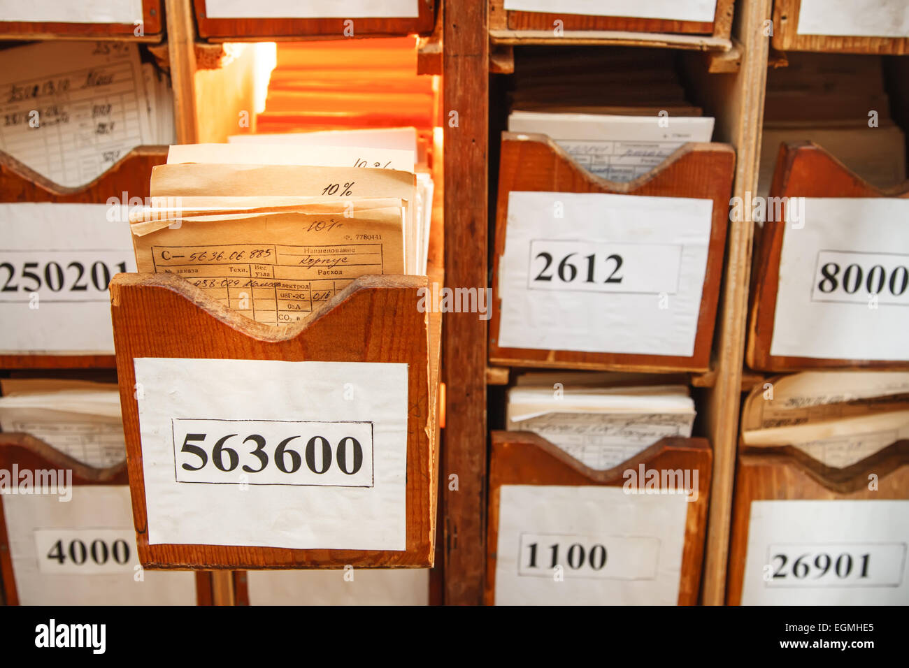 Paper documents stacked in archive on shelf Stock Photo - Alamy