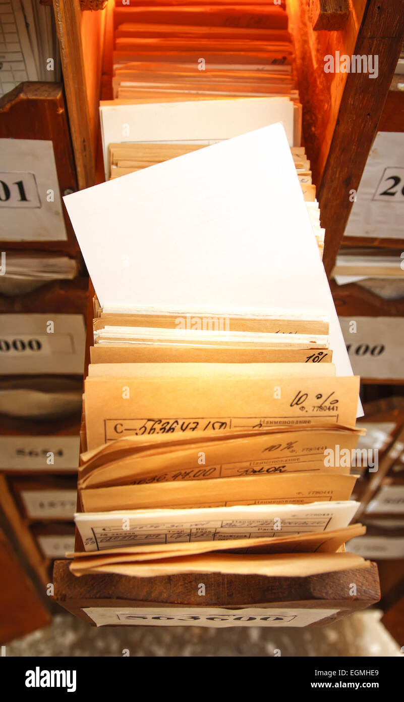 Paper documents stacked in archive on shelf Stock Photo - Alamy