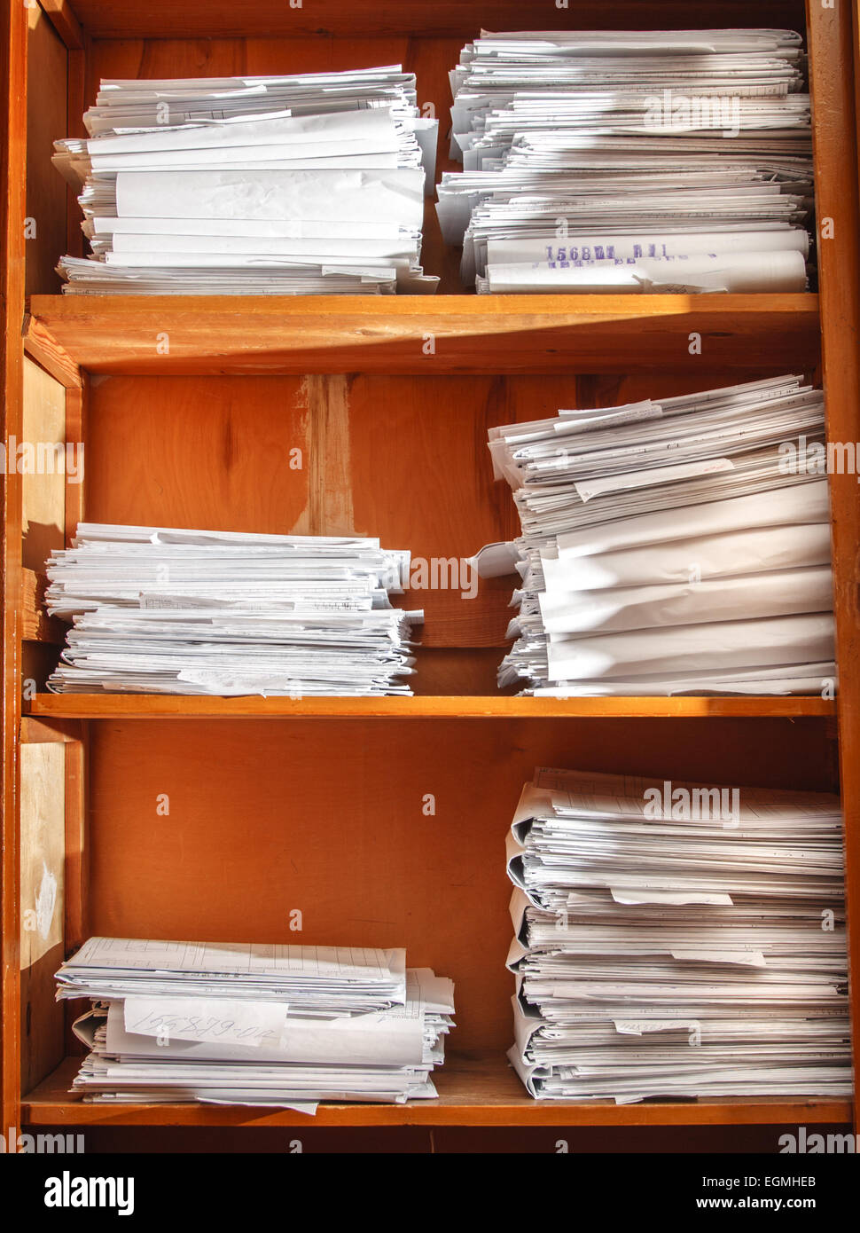 Paper documents stacked in archive on shelf Stock Photo - Alamy