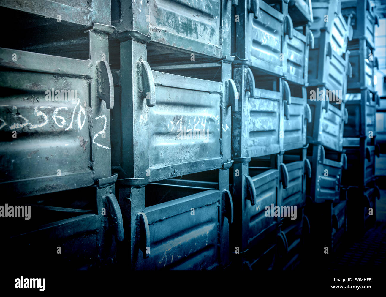 Old metal boxes stacked in storehouse of factory Stock Photo - Alamy